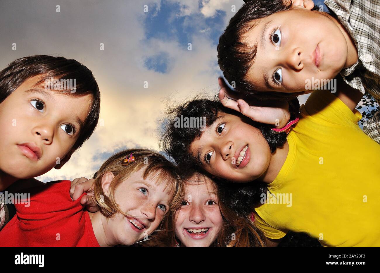 Small group of happy children outdoor Stock Photo - Alamy
