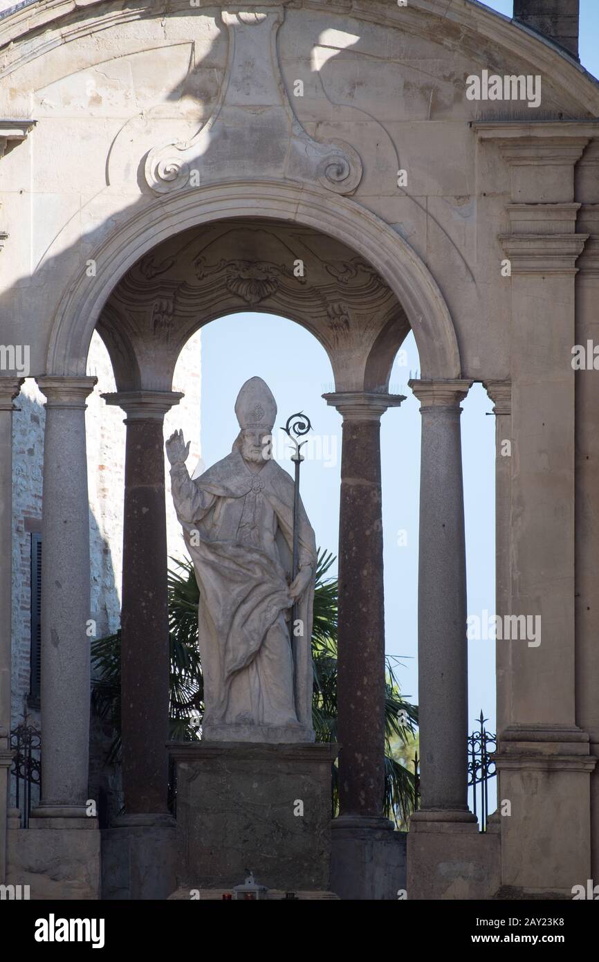 Statue of St. Ubaldo XVIII in historic centre of Gubbio, Umbria, Italy ...