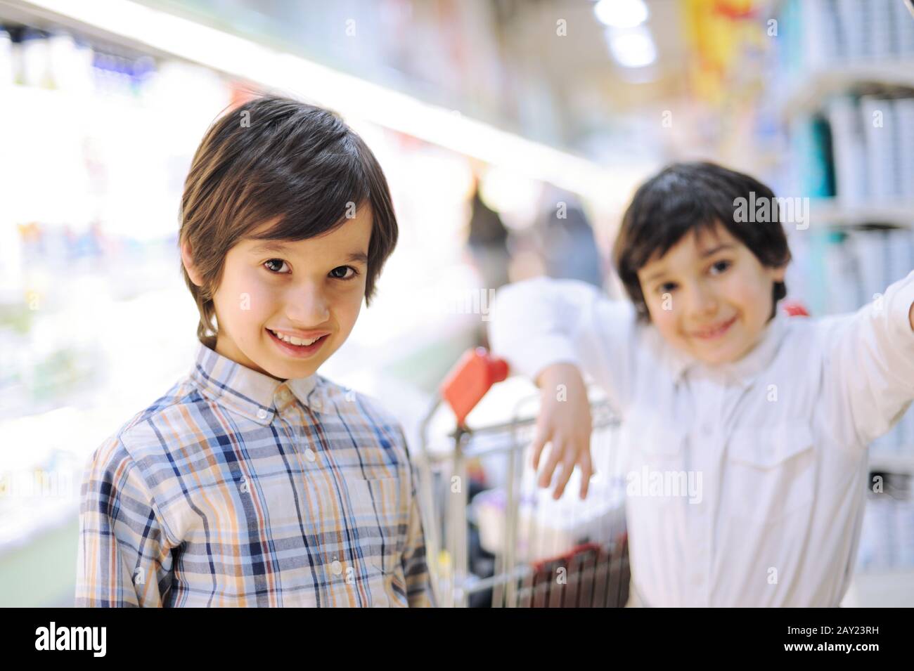 Two brothers in shopping mall Stock Photo - Alamy