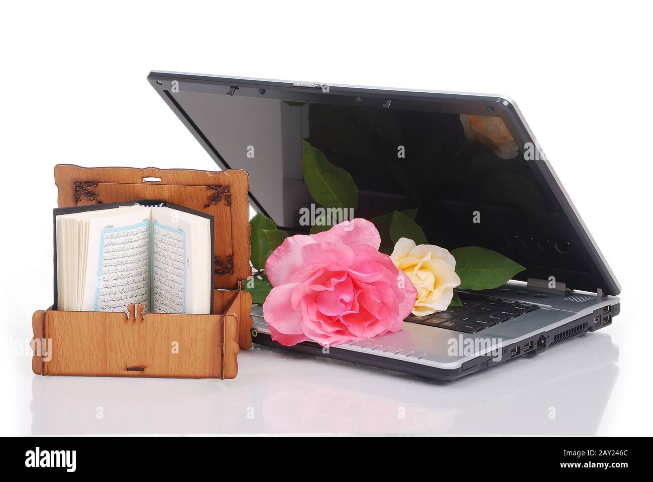 Beautiful roses and laptop Stock Photo - Alamy
