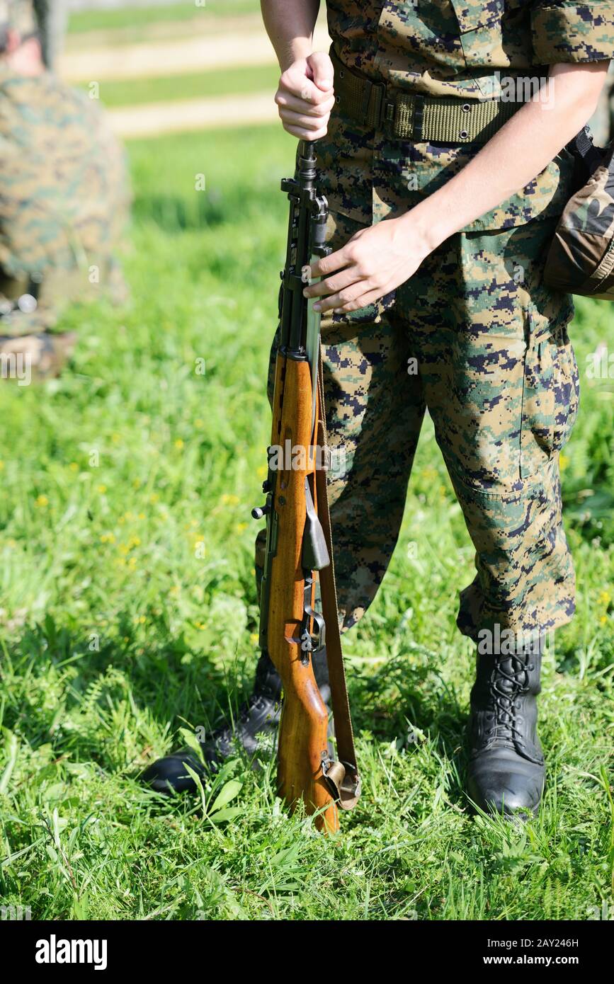 Military rifle and helmet Stock Photo - Alamy