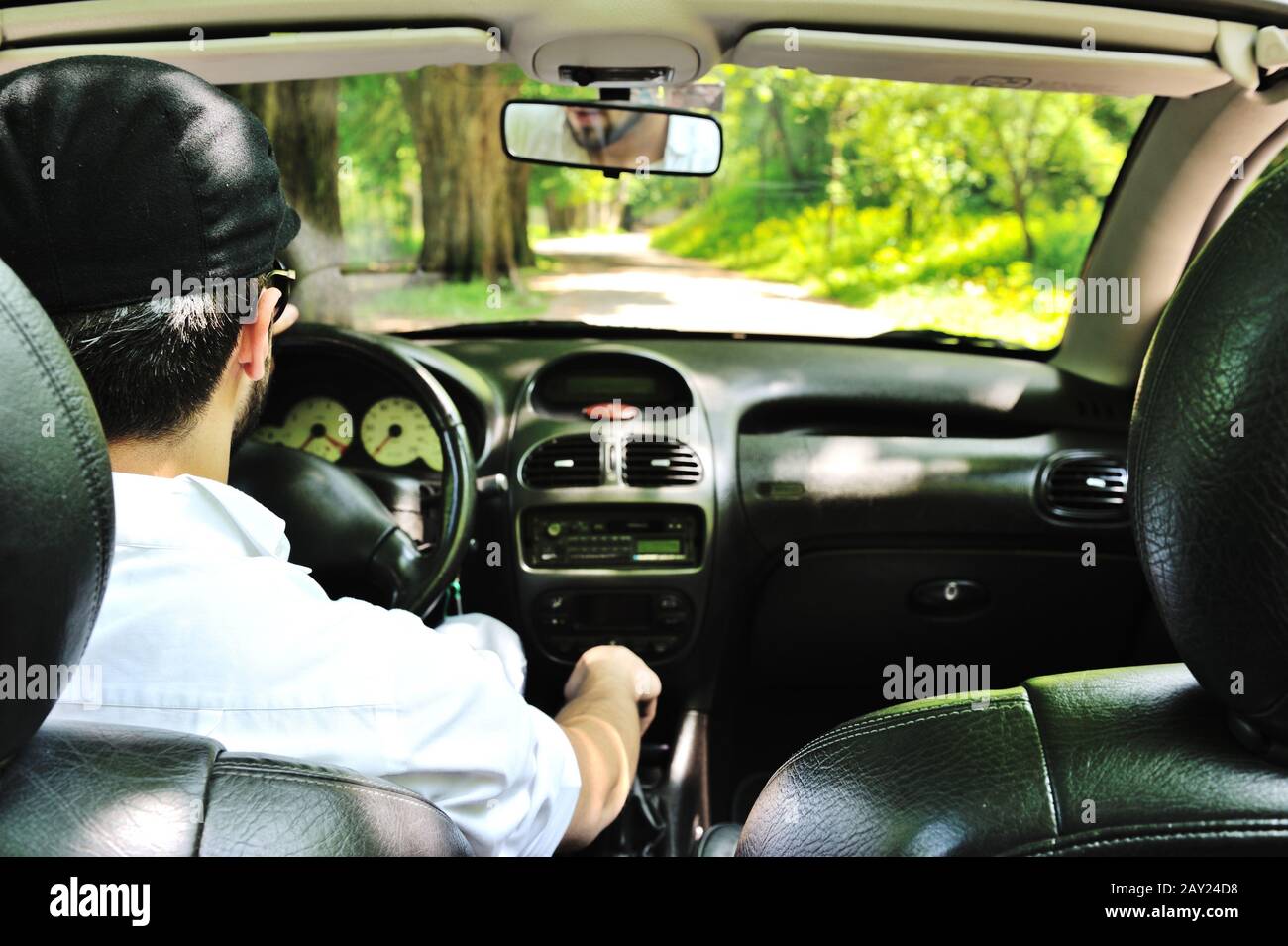 Potrait of a man driving a car without safety belt Stock Photo - Alamy