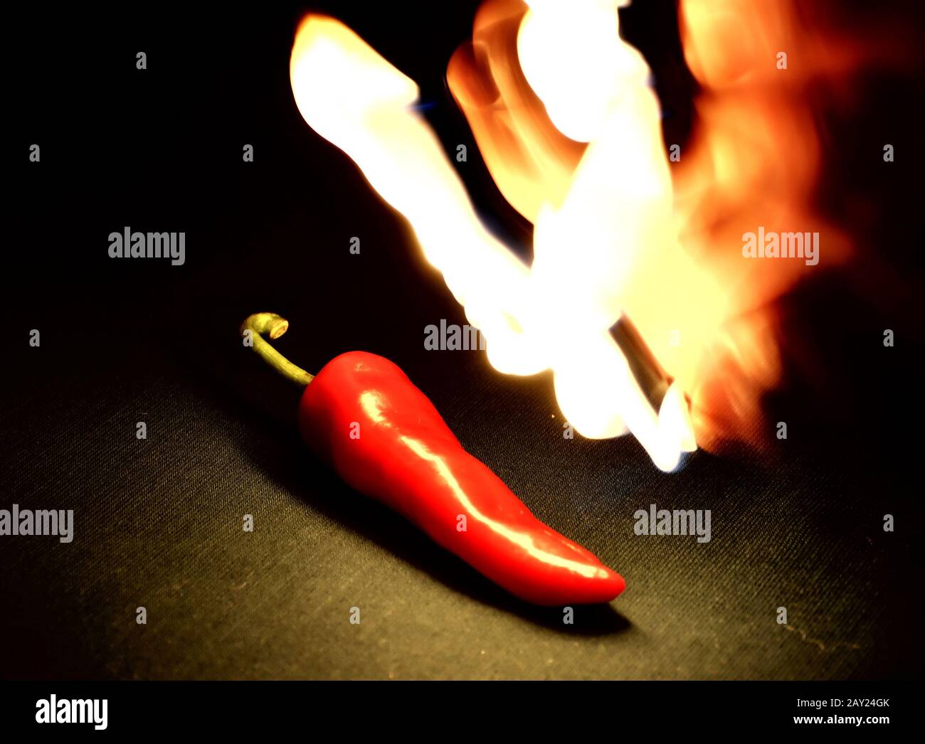 Flame on red hot paprika Stock Photo - Alamy