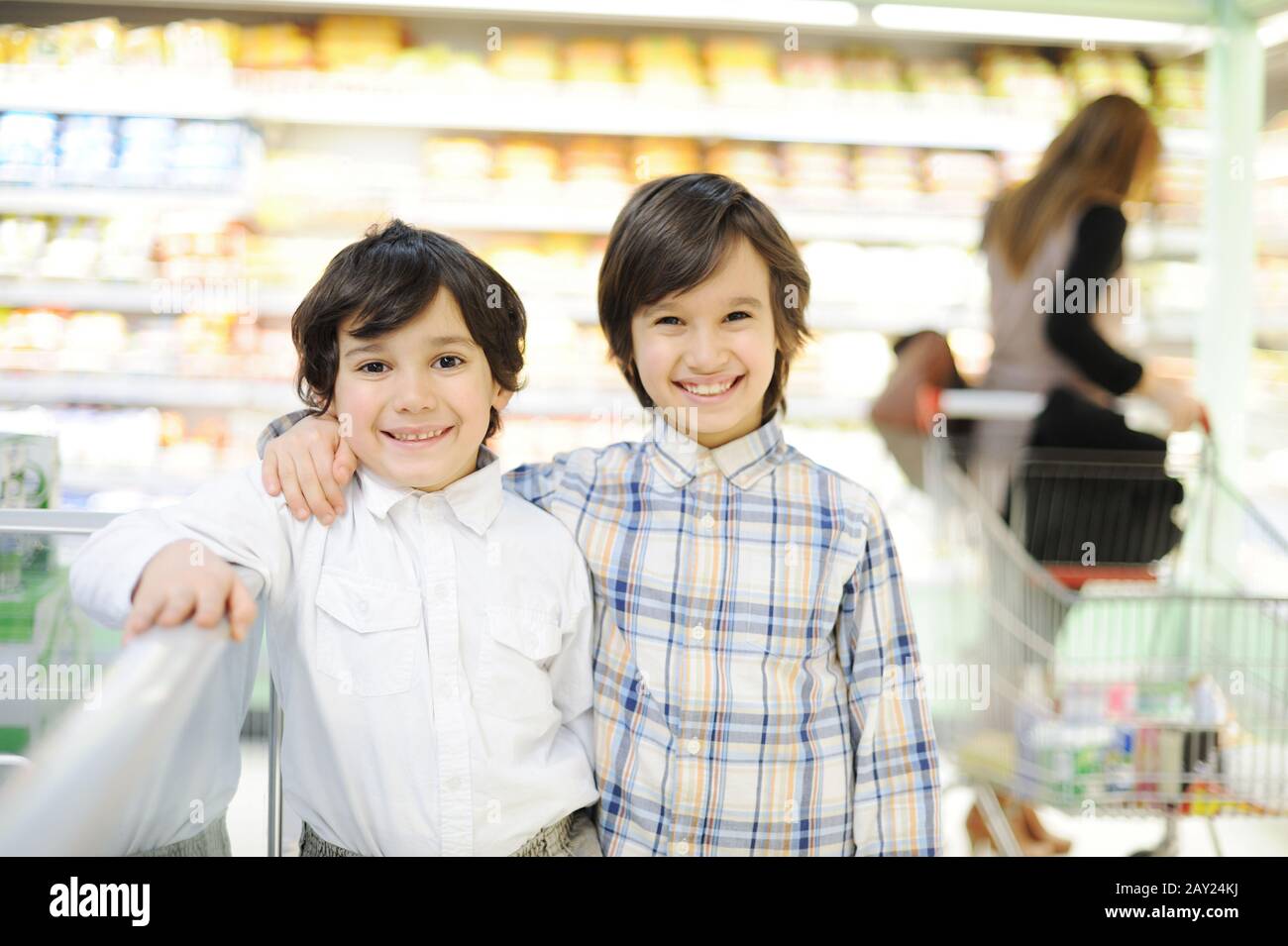 Two beautiful kids in shopping mall Stock Photo - Alamy