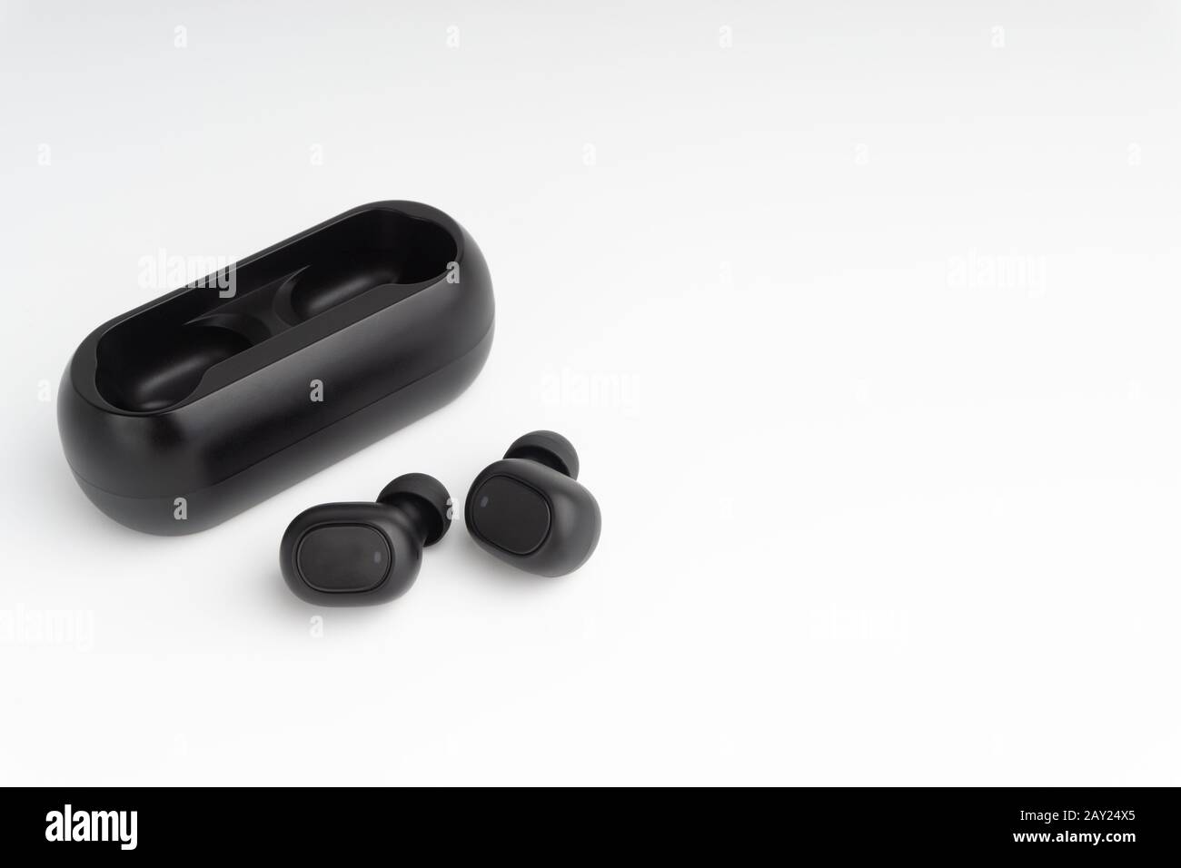 Wireless earbuds or earphones on white background. Copy space and ...
