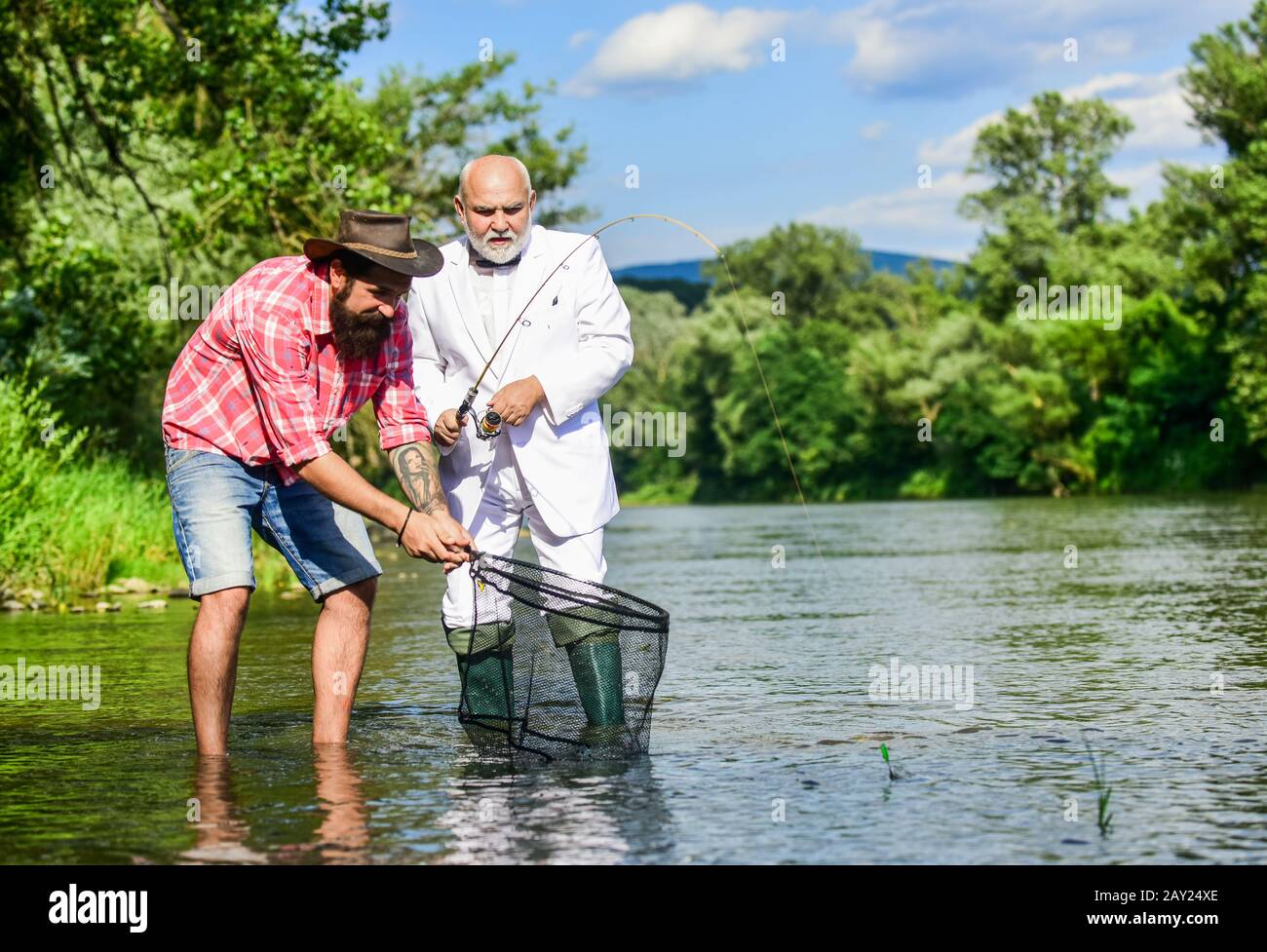 happy fishermen friendship. Catching and fishing concept. Two male ...