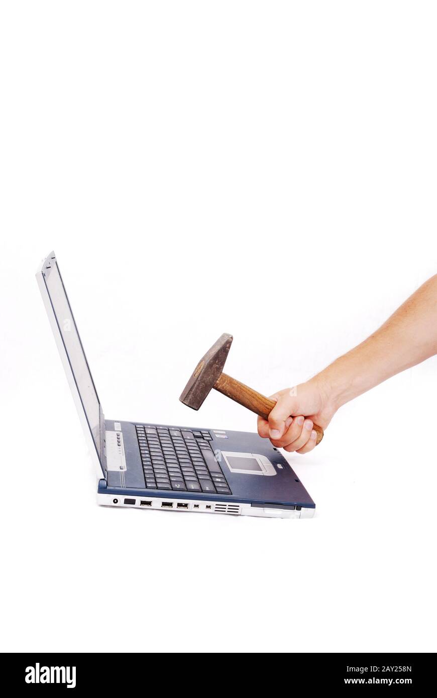 Hand over laptop about to crash it Stock Photo - Alamy