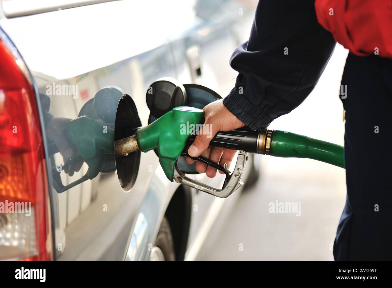 Close-up image of a mens hand refilling the car with a gas pump Stock ...