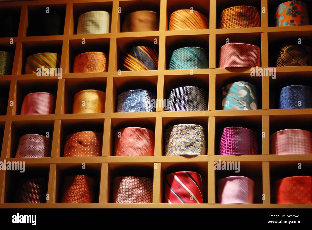 Different colored fasion ties on shelves Stock Photo - Alamy
