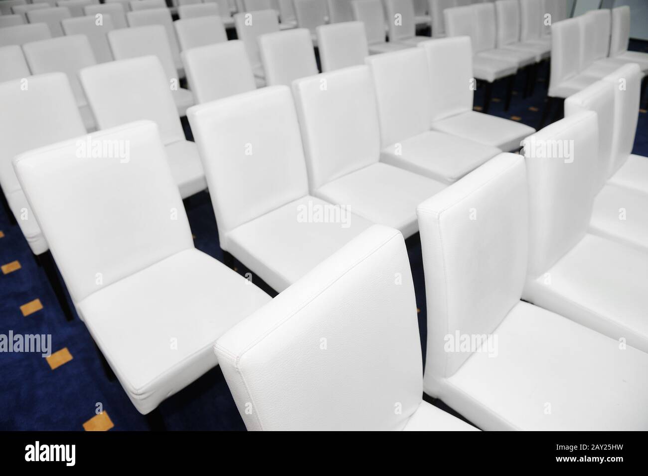 White chairs in conference room Stock Photo - Alamy