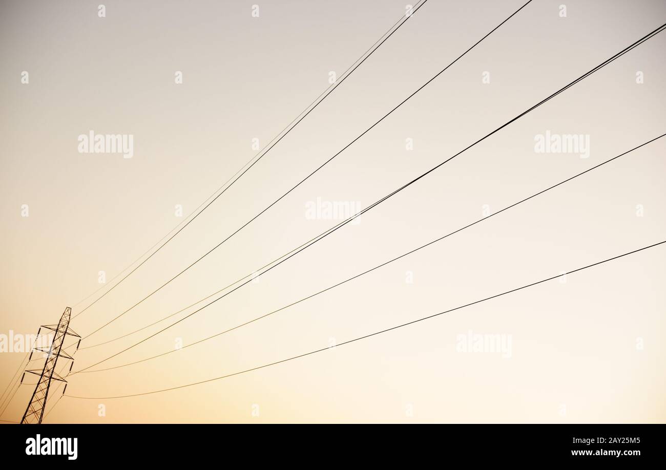 Wires of electricity transmissions last from support Stock Photo - Alamy