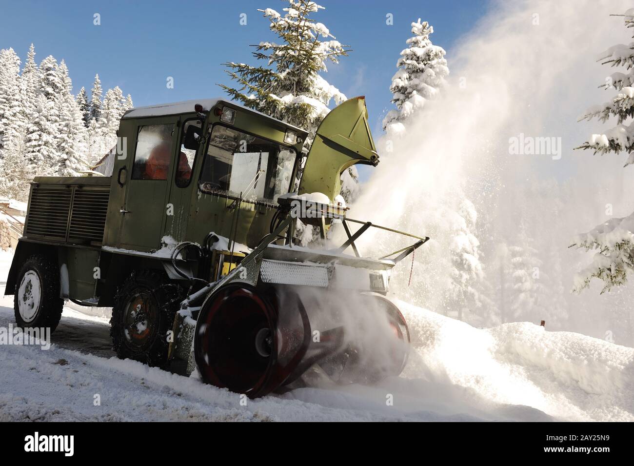 Special winter vehicle for removing snow from road in action Stock ...