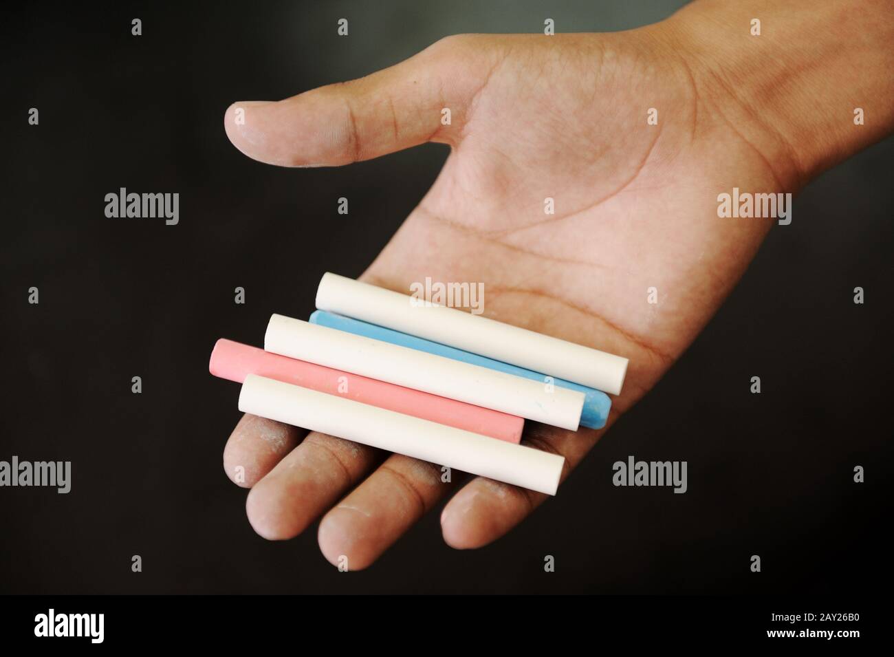 Chalks in hand Stock Photo - Alamy