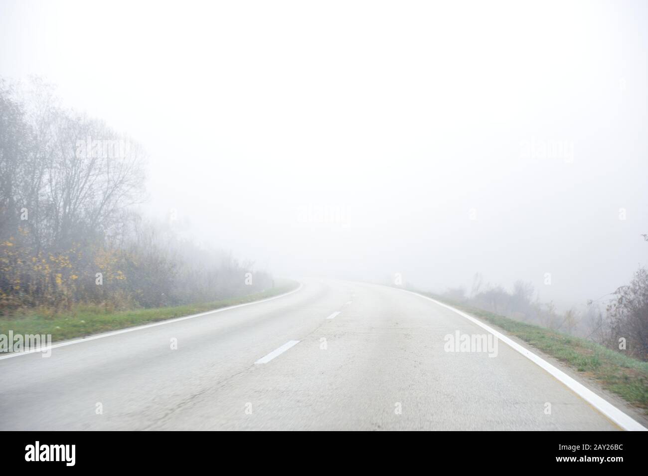 Road in fog Stock Photo - Alamy