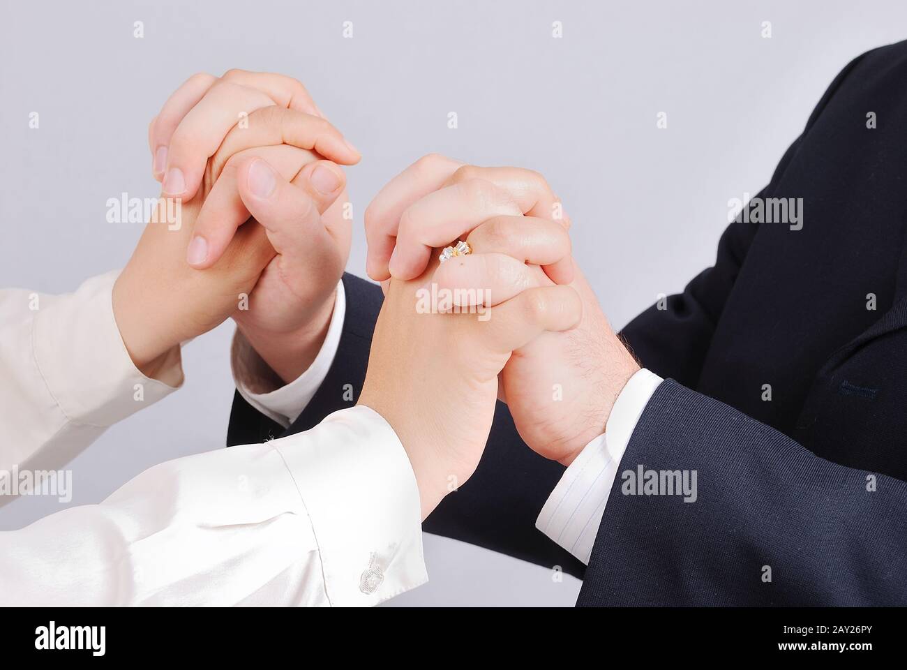 Connected hands of two young lovers Stock Photo - Alamy