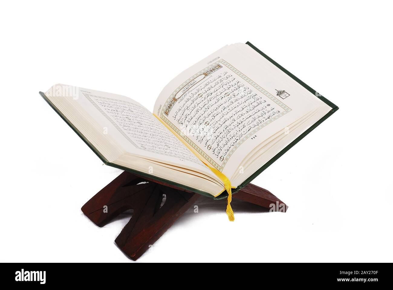 Holy islamic book Koran opened and isolated Stock Photo - Alamy