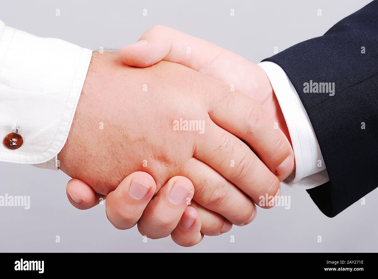 Two white male hands shaking Stock Photo - Alamy