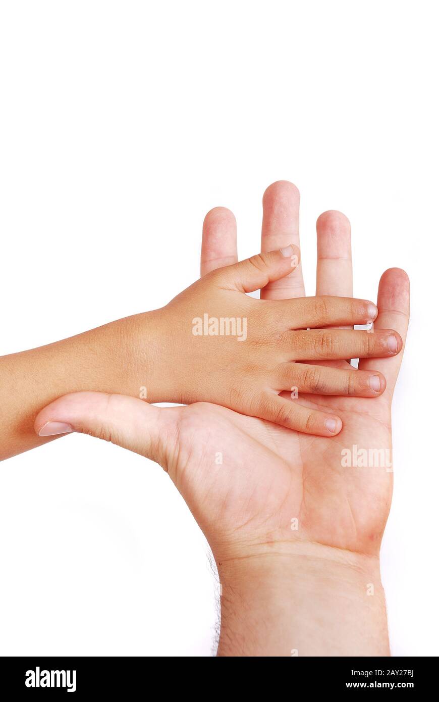 Little hand put on the big one Stock Photo - Alamy