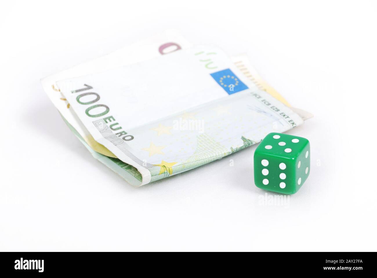 Euro currency and gamble cube isolated Stock Photo - Alamy