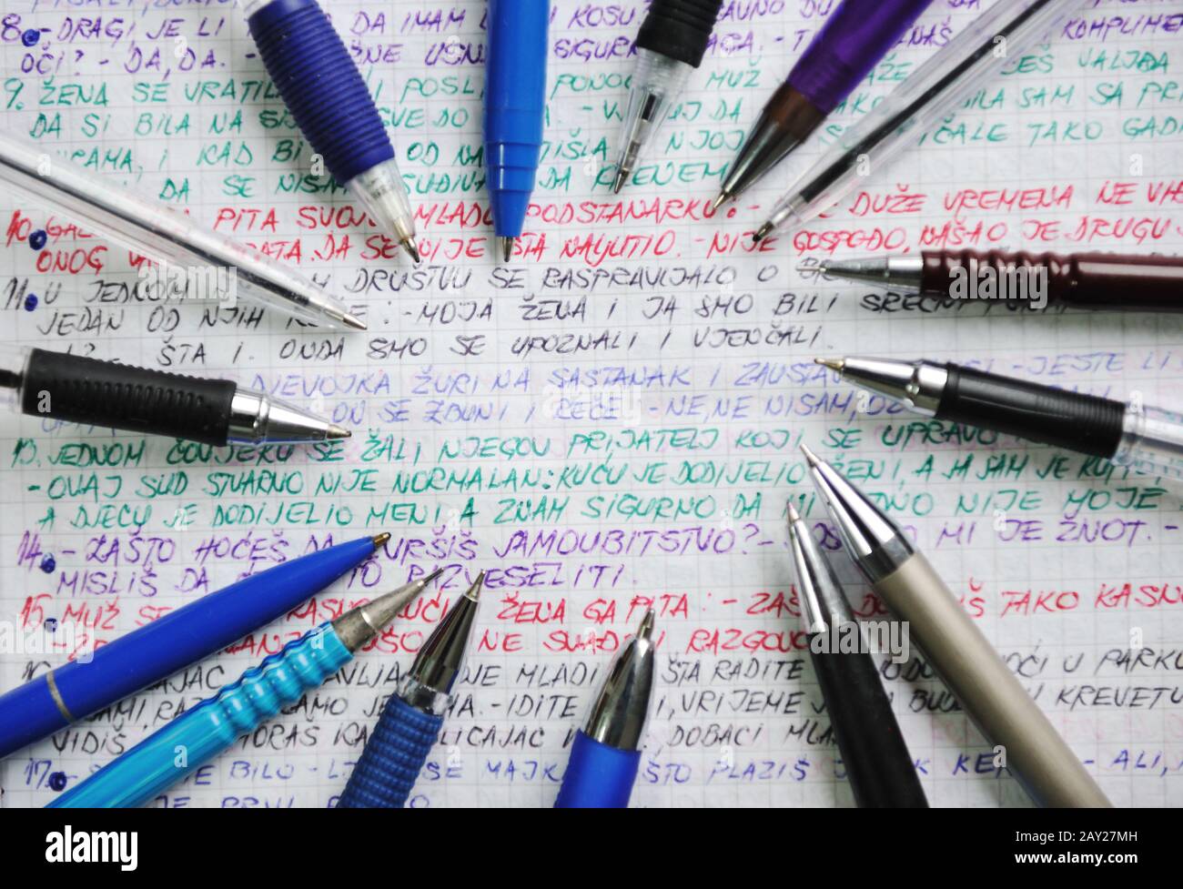 Pens and handwriting colorful notebook Stock Photo - Alamy