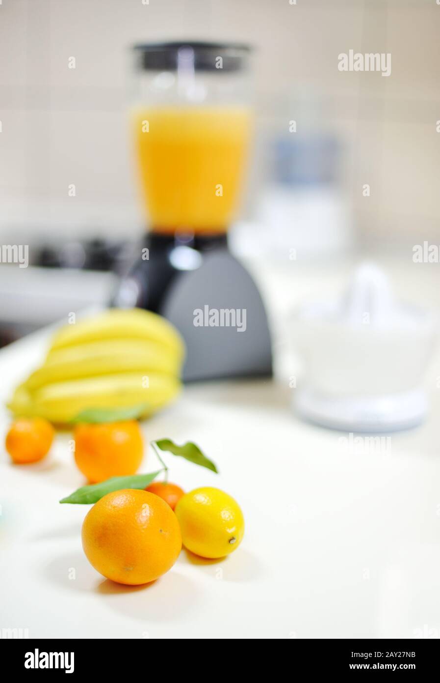 Fresh orange juice making at home in kitchen Stock Photo - Alamy