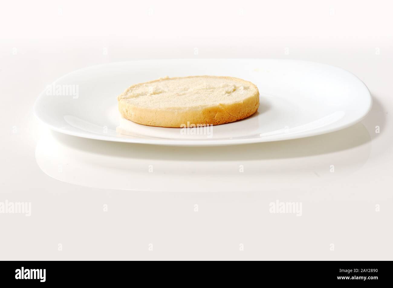 Slice of bread on plate Stock Photo - Alamy