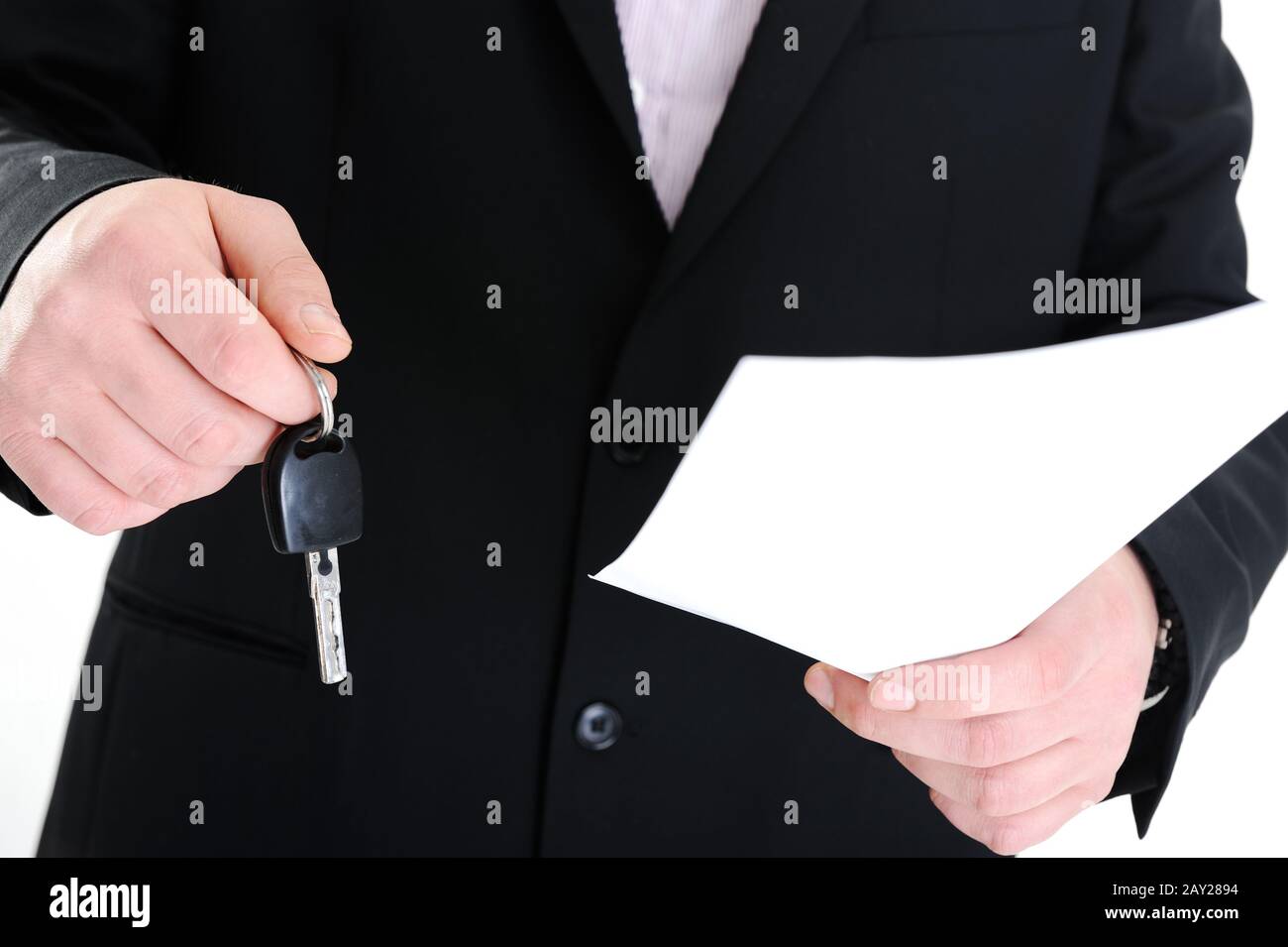 Closeup of businessman with key and paper agreement Stock Photo - Alamy