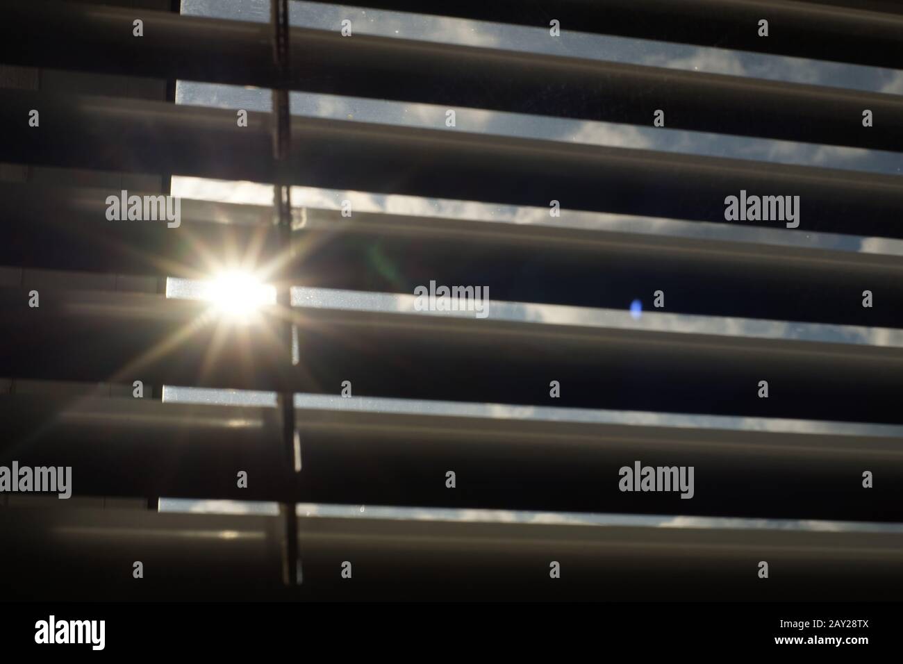 Sun shine outdoor. Window with closed blinds in dark room Stock Photo ...