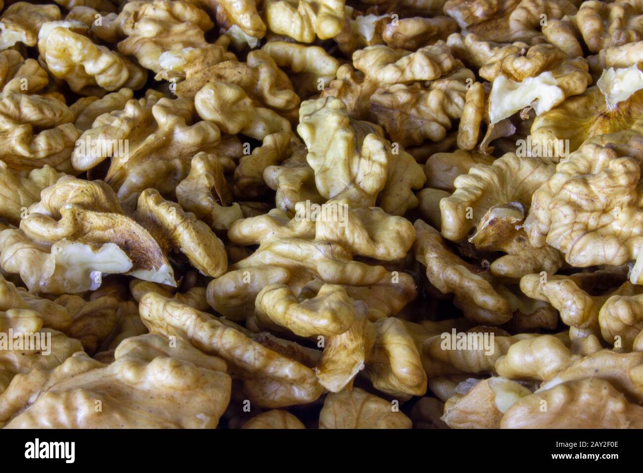 Walnut kernel texture closeup. Background of nuts Stock Photo - Alamy