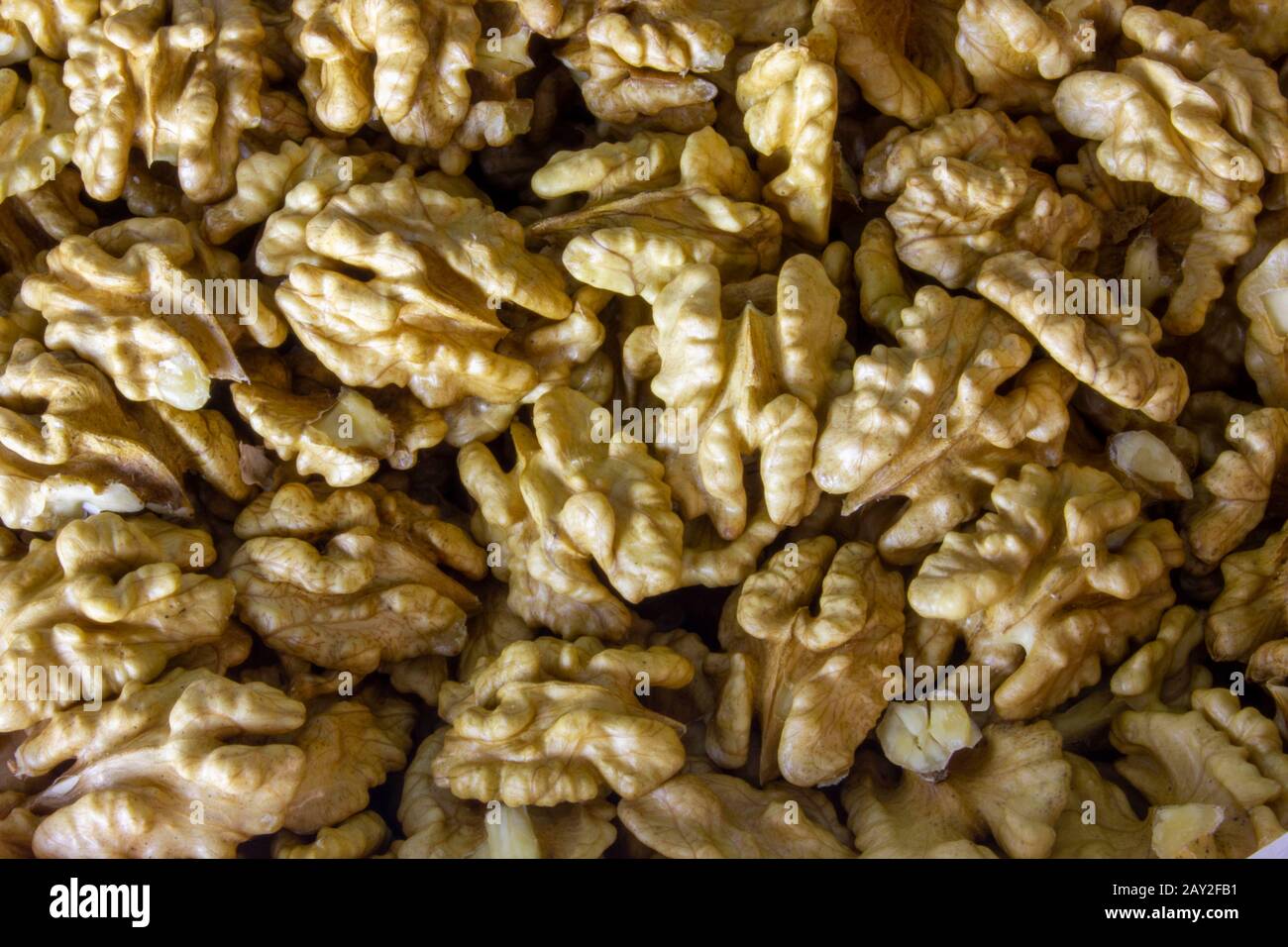Walnut kernel texture closeup. Background of nuts Stock Photo - Alamy