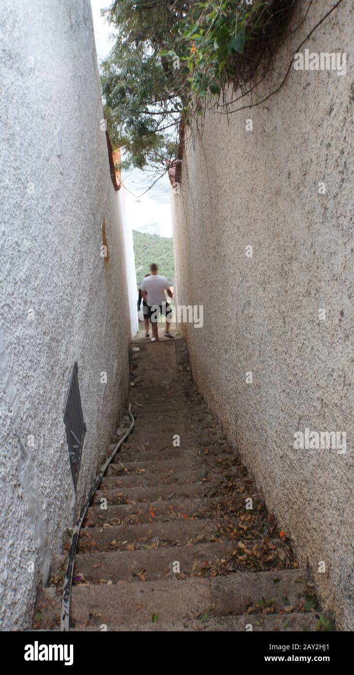 narrow staircase between two walls Stock Photo - Alamy