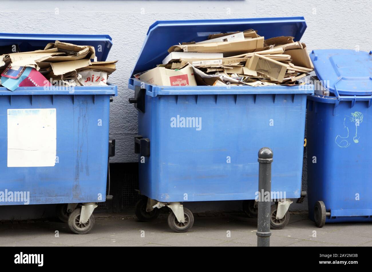 Blue barrels of paper waste Stock Photo - Alamy