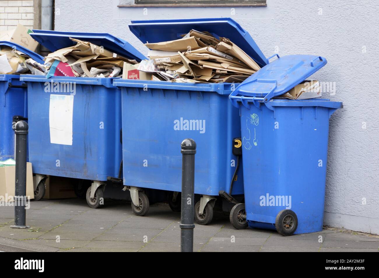 Blue barrels of paper waste Stock Photo - Alamy