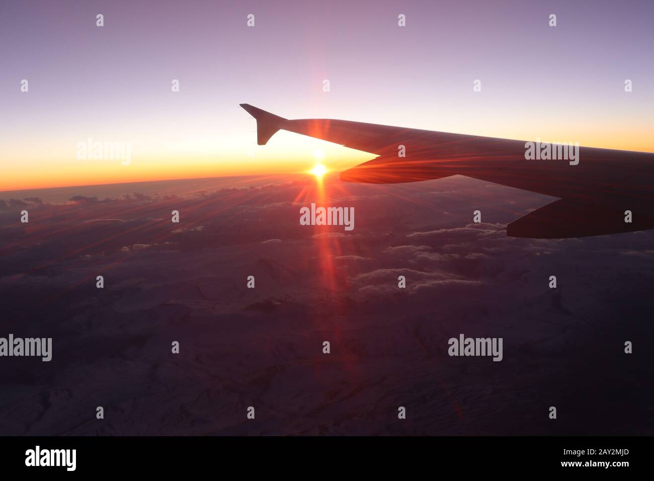 Sunset view from the airplane window Stock Photo - Alamy