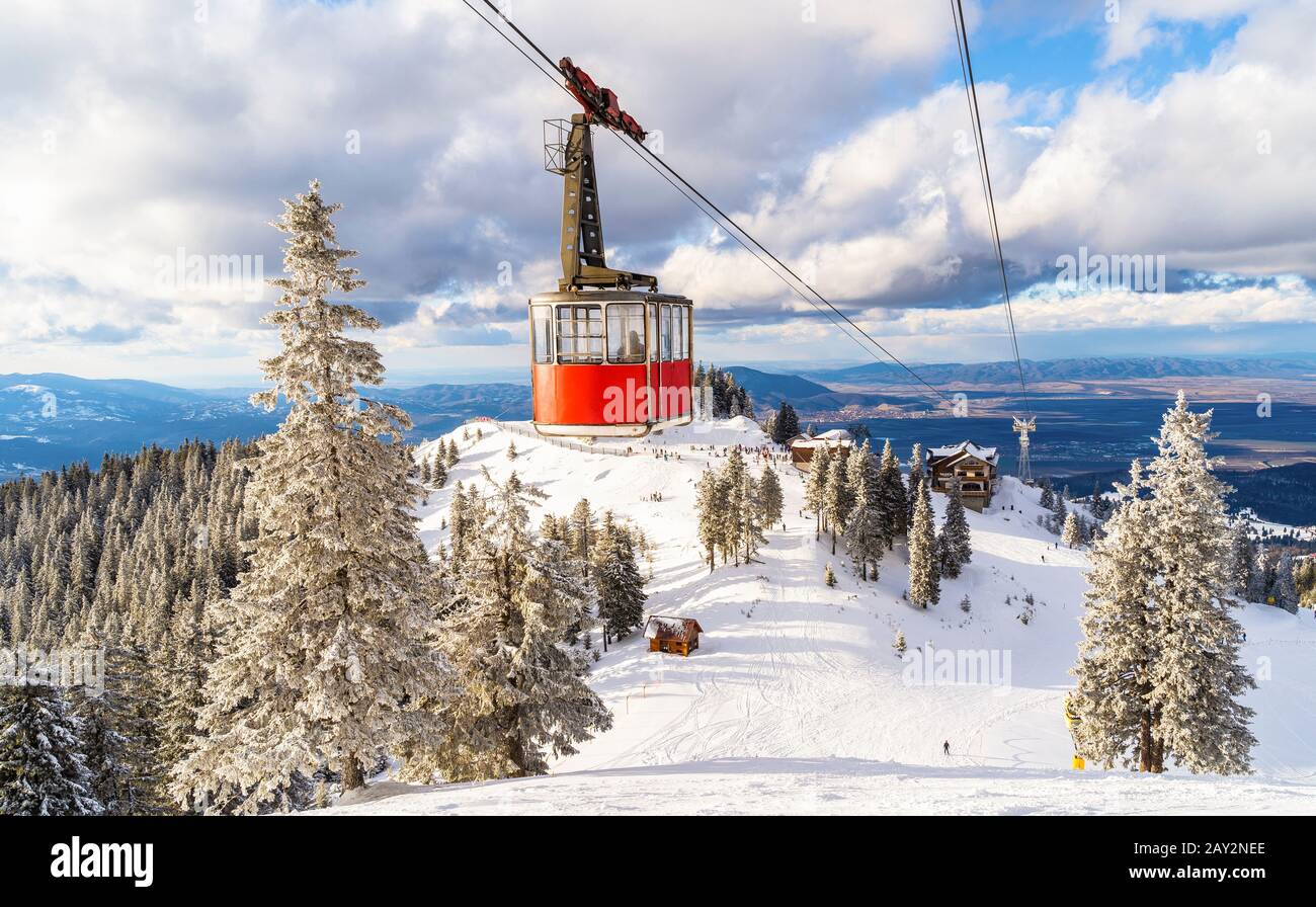 Landscape from top of Postavaru mountain with ski slopes and cable car ...