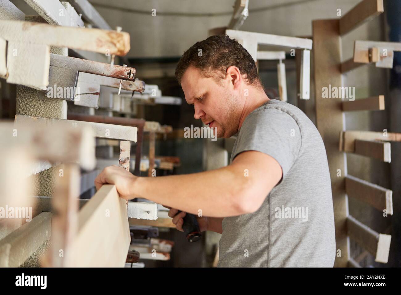 Craftsman during a material inspection in the wood warehouse of the ...
