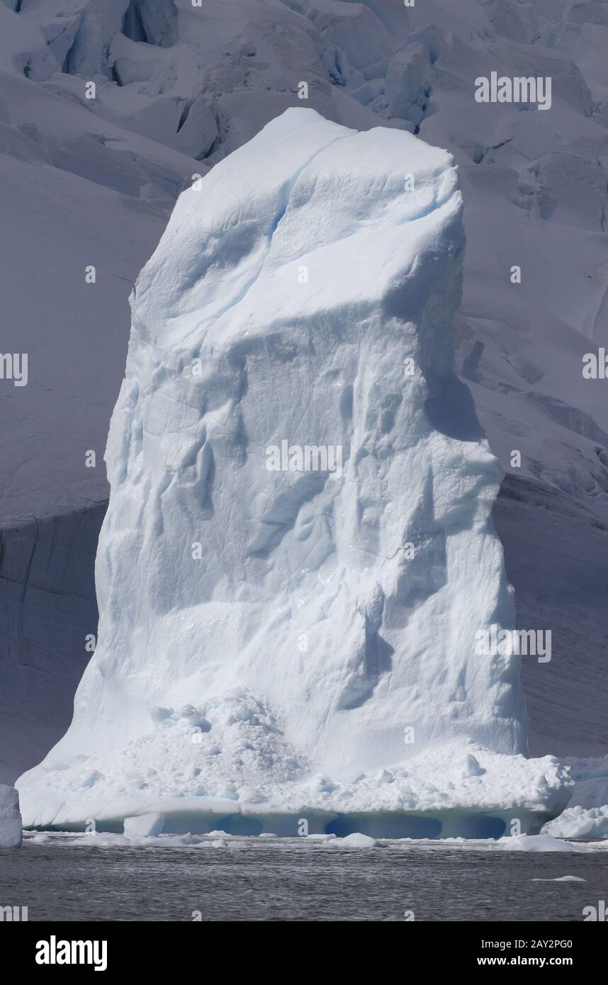 iceberg as a pillar on the background of the glacier Stock Photo - Alamy