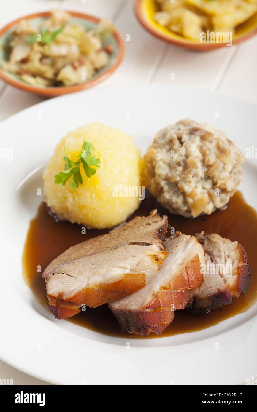 Bavarian roasted pork and beer Stock Photo - Alamy