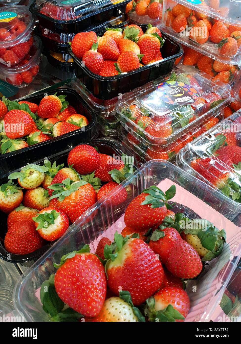 Moscow, Russia - Jan 27. 2020. Fresh strawberries in plastic containers ...