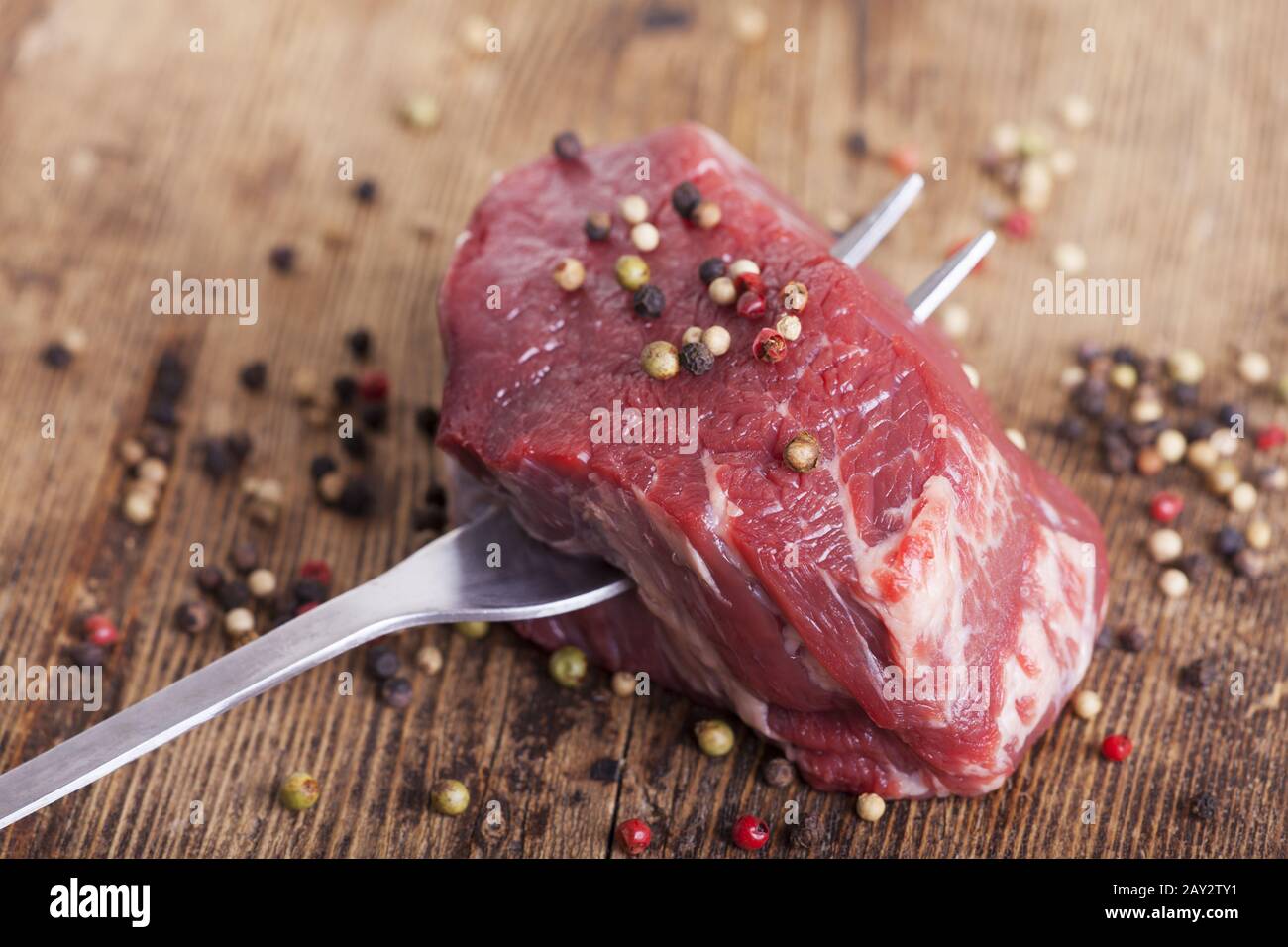 Steak on a meat fork Stock Photo - Alamy