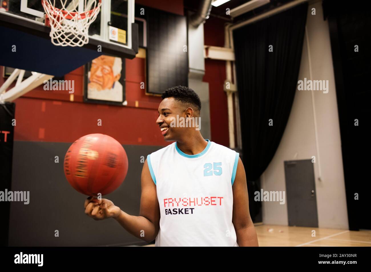 Smiling basketball player Stock Photo - Alamy