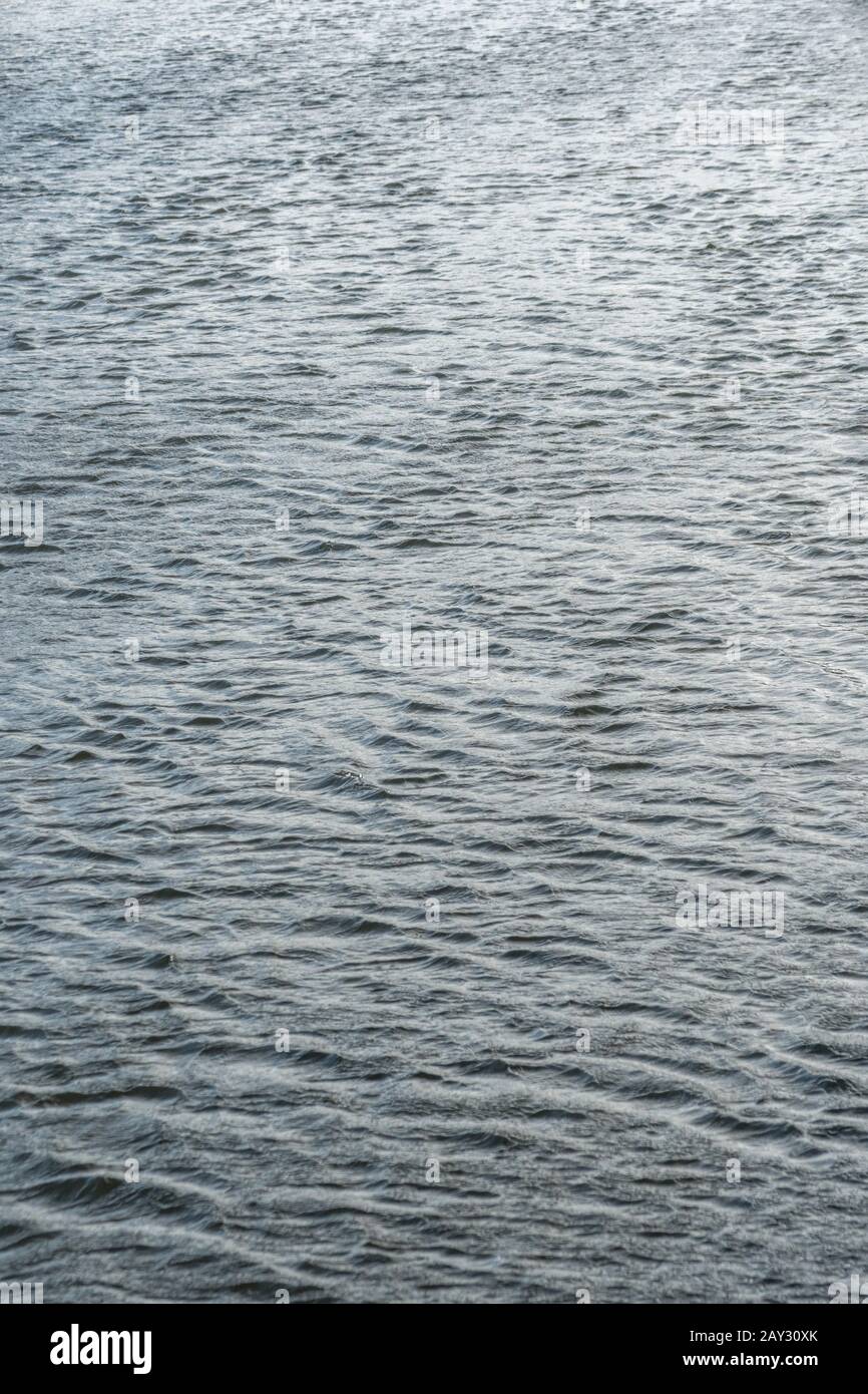 Slightly turbulent water ripples on River Fowey, Lostwithiel, Corrnwall ...