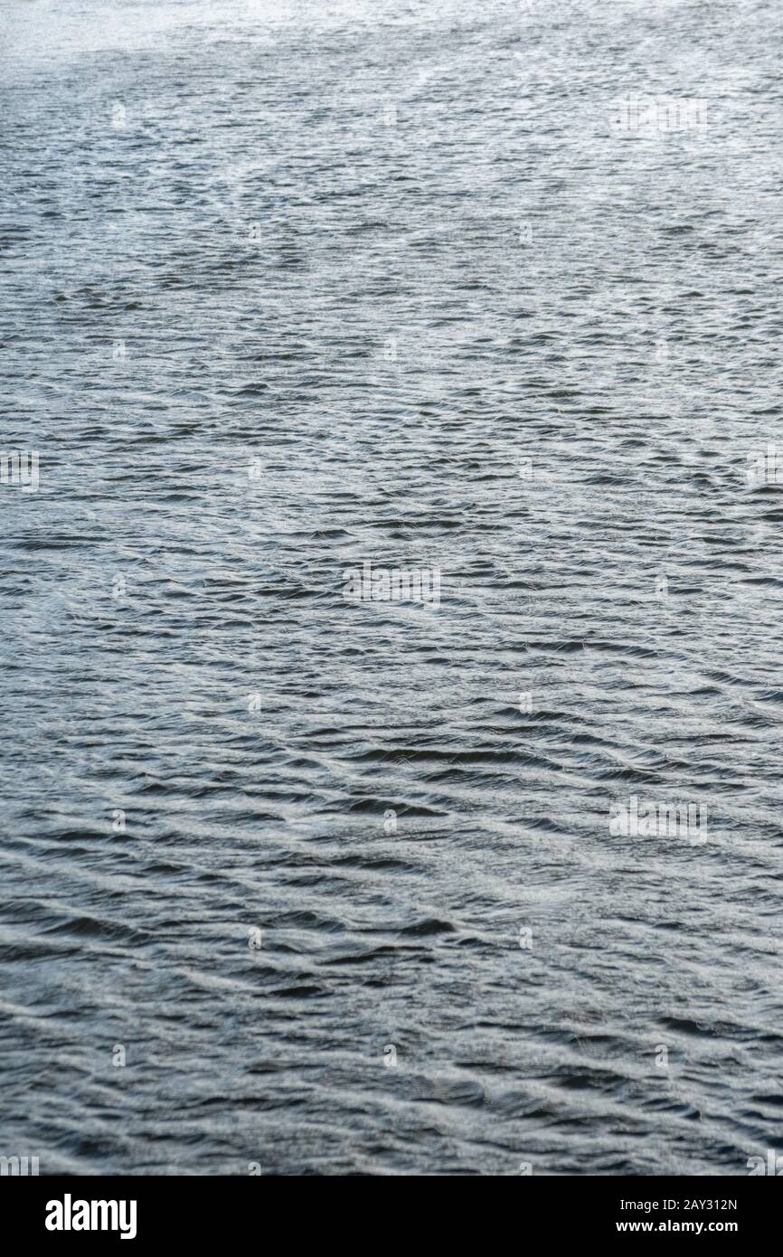 Slightly turbulent water ripples on River Fowey, Lostwithiel, Corrnwall ...