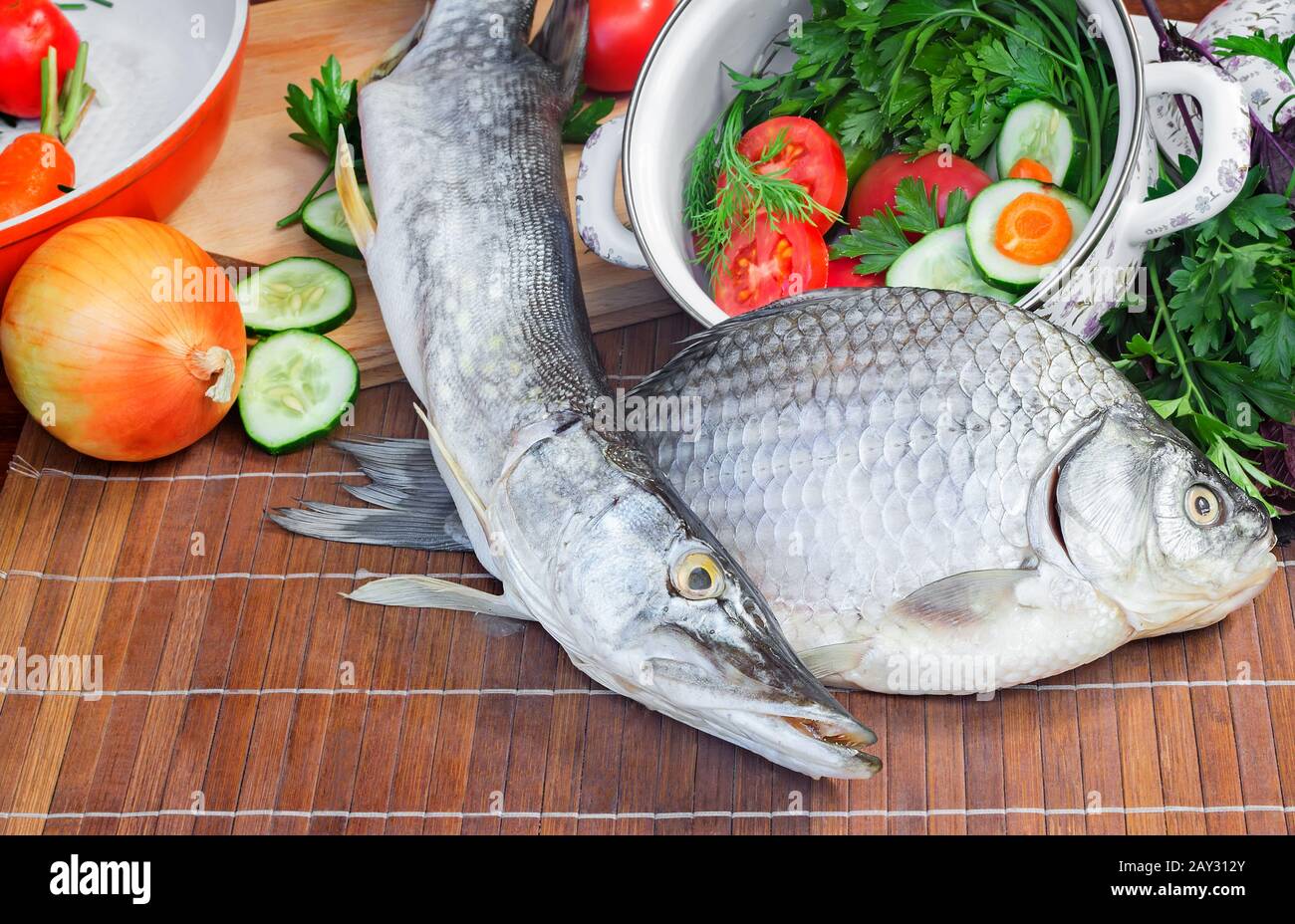 Fish and components for her preparation: vegetable Stock Photo - Alamy