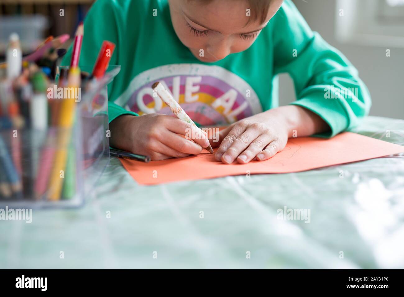 Boy drawing on paper Stock Photo - Alamy