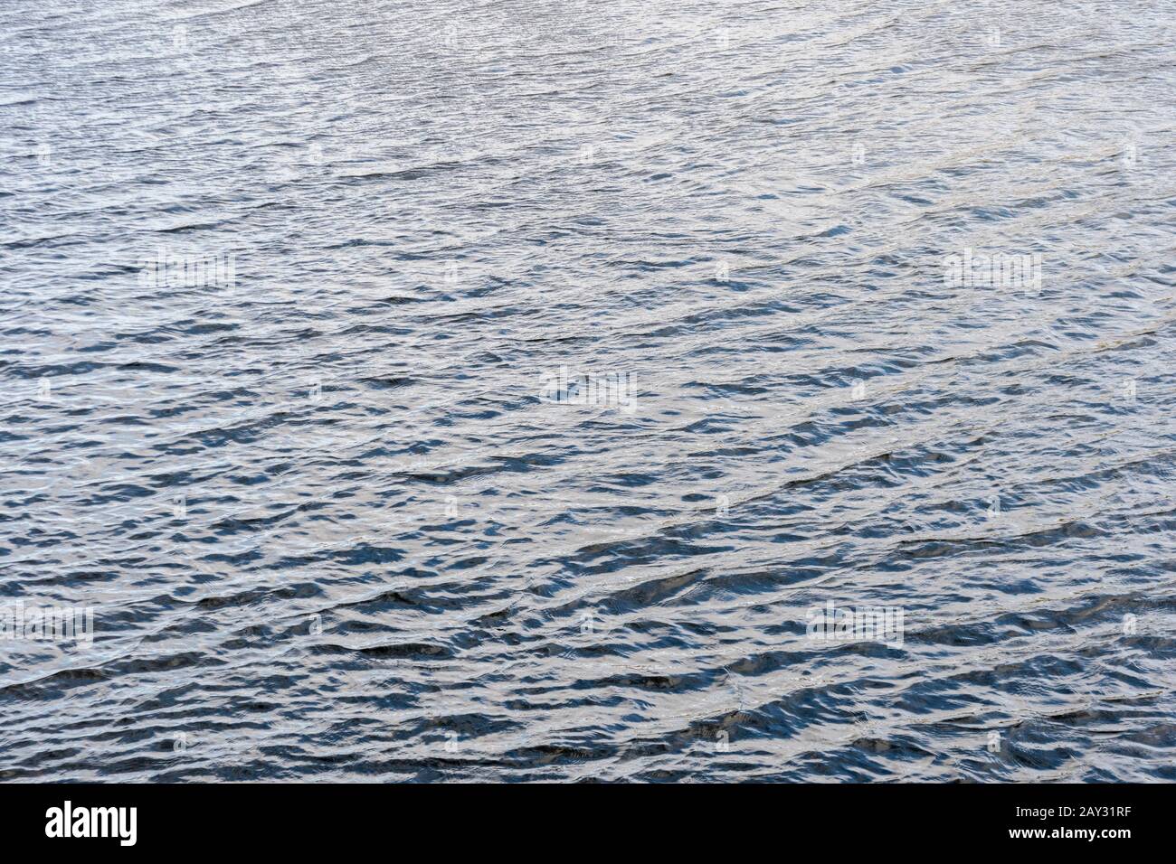 Calm water ripples on the River Fowey at Lostwithiel in Corrnwall ...