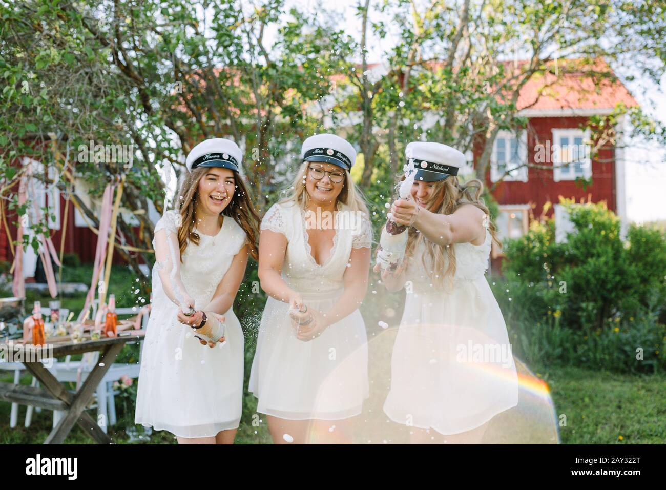 Women celebrating graduation with champagne Stock Photo - Alamy