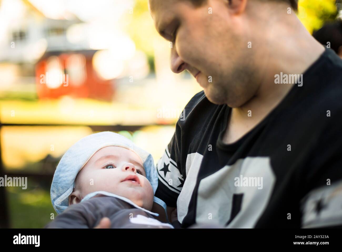 dad carries on his child Stock Photo - Alamy