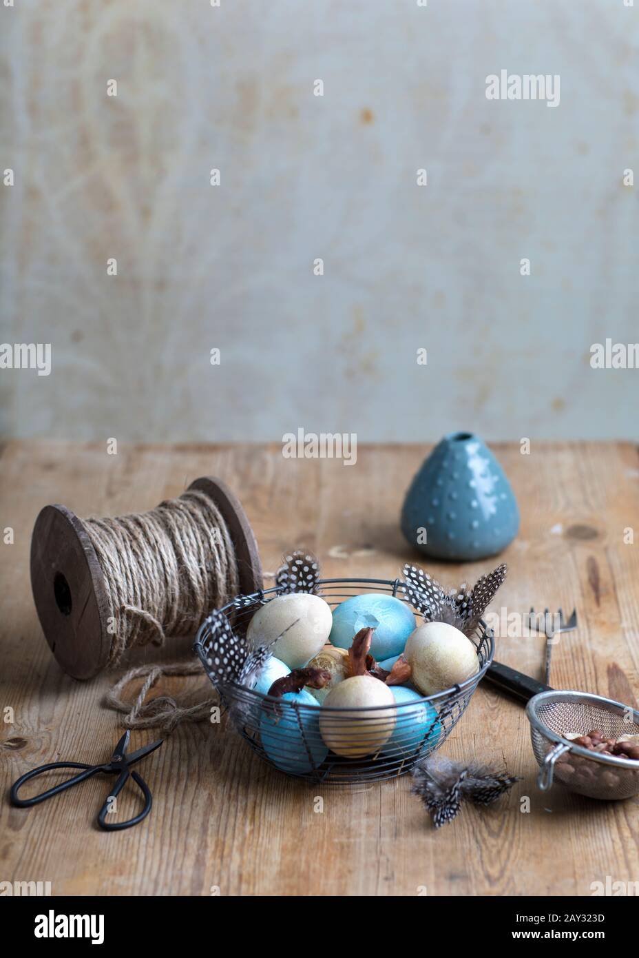 Easter eggs in wire basket Stock Photo - Alamy