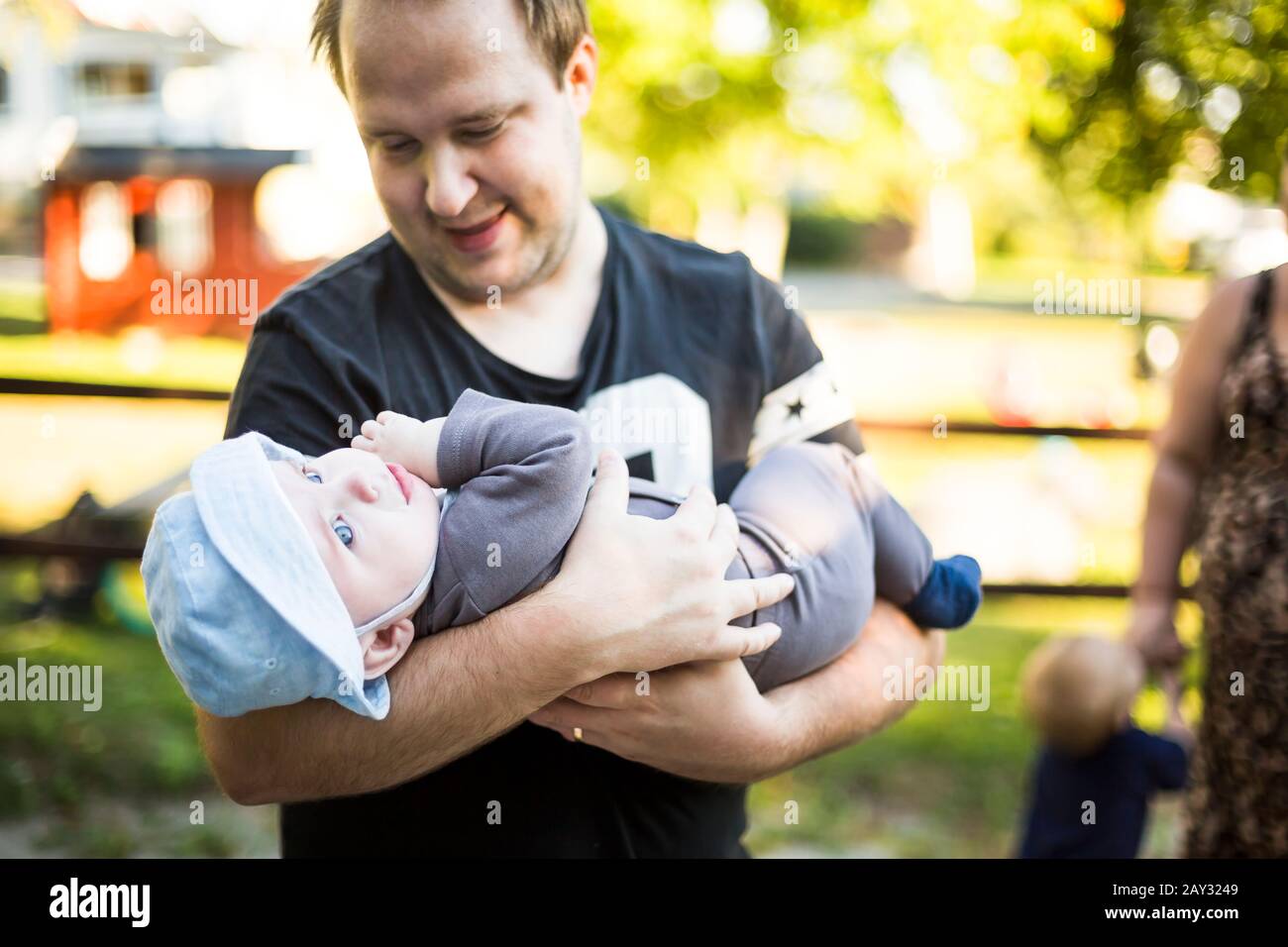 dad carries on his child Stock Photo - Alamy